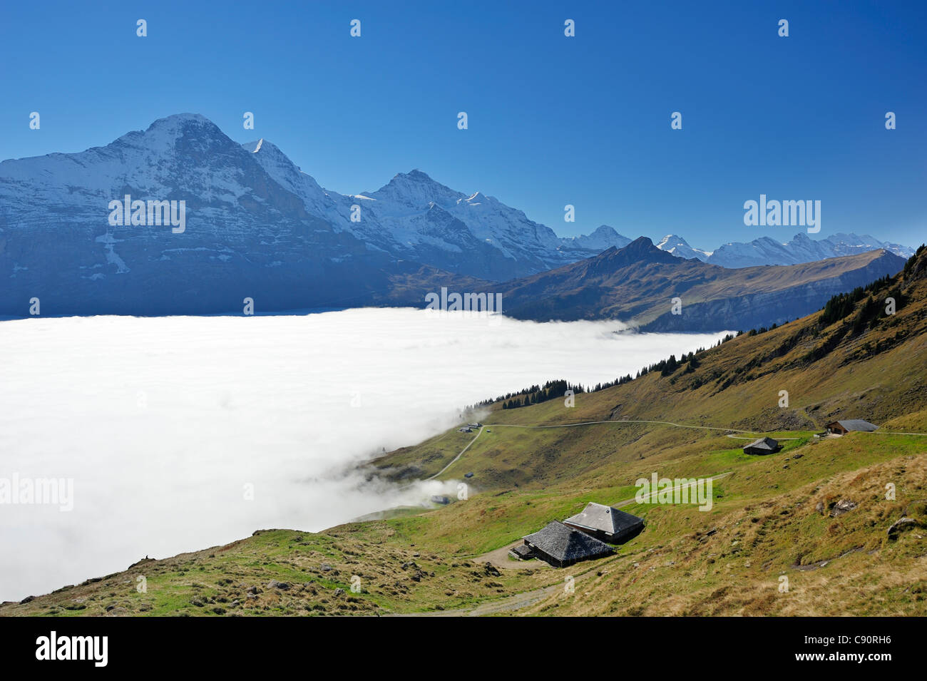 Almhütten vor Eiger, Mönch und Jungfrau mit Nebelmeer über Grindelwald ... Almhütten vor Eiger, Mönch und Jungfrau mit Nebelmeer über Grindelwald ...