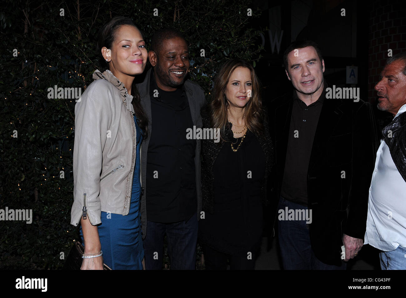 Kelly Preston und John Travolta posiert für Fotos außen Herr Chow ...