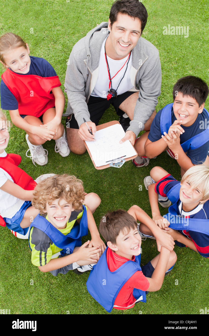 Children Sitting Soccer Ball Outdoors Stockfotos und -bilder Kaufen - Alamy
