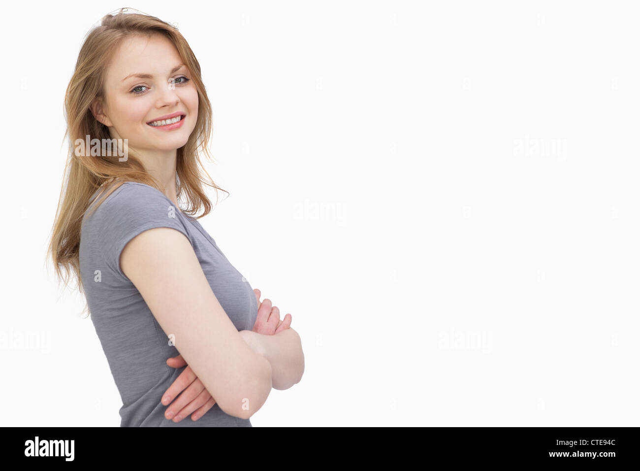 Frau arme verschränkt seite Ausgeschnittene Stockfotos und -bilder - Alamy