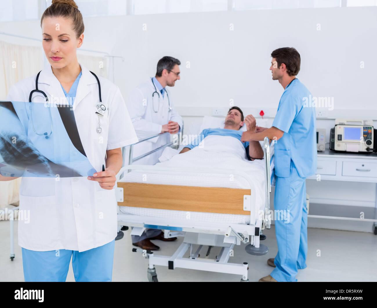 Doctor examining x ray patient lying -Fotos und -Bildmaterial in hoher ...