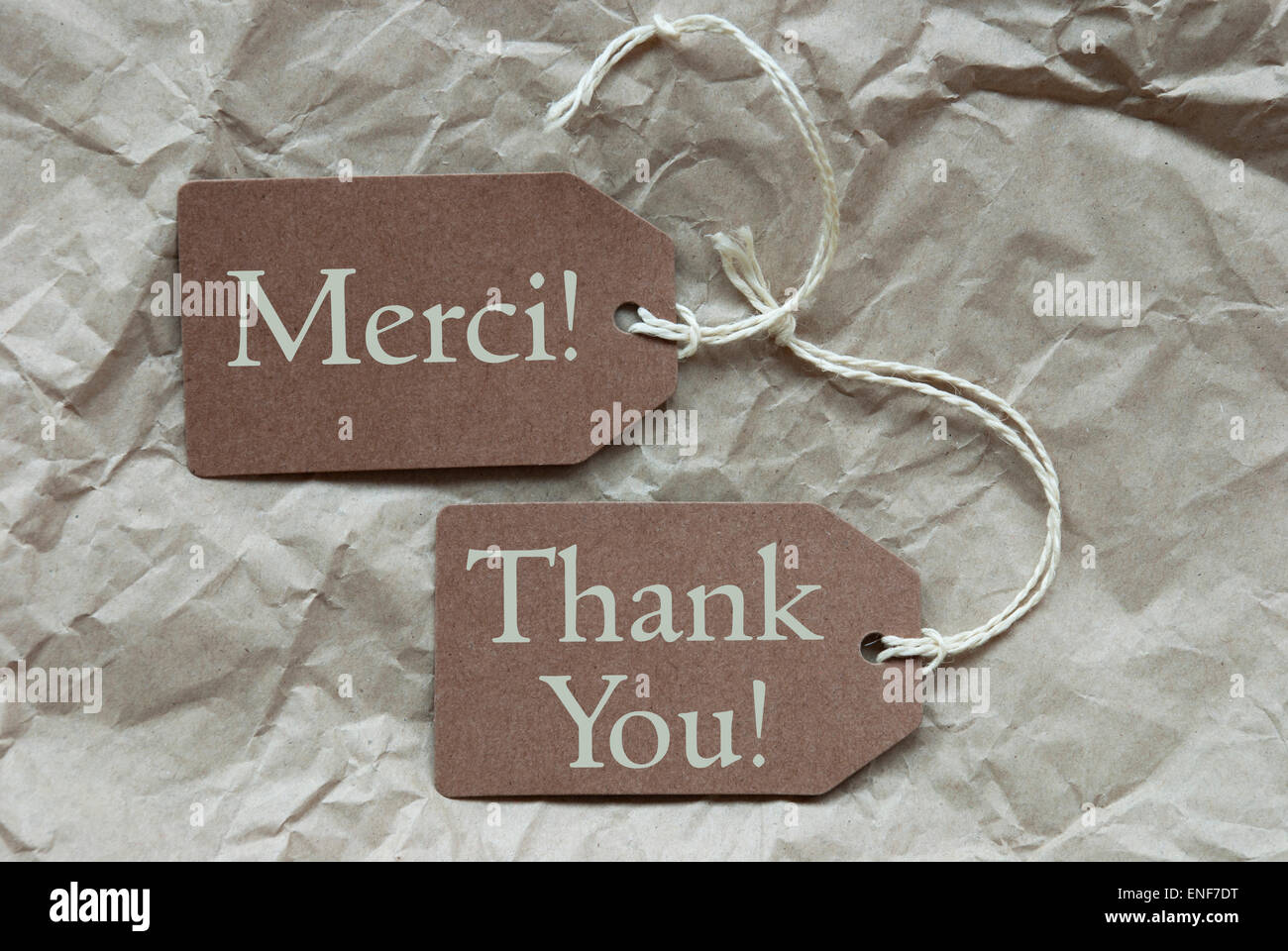 Zwei Beige Etiketten bedeutet Merci danke Stockfotografie - Alamy