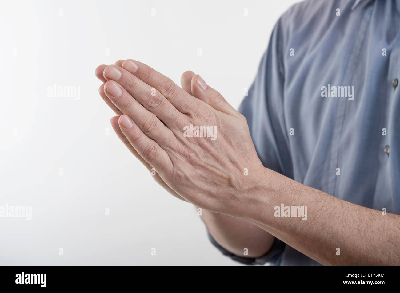 Clasped hands -Fotos und -Bildmaterial in hoher Auflösung – Alamy
