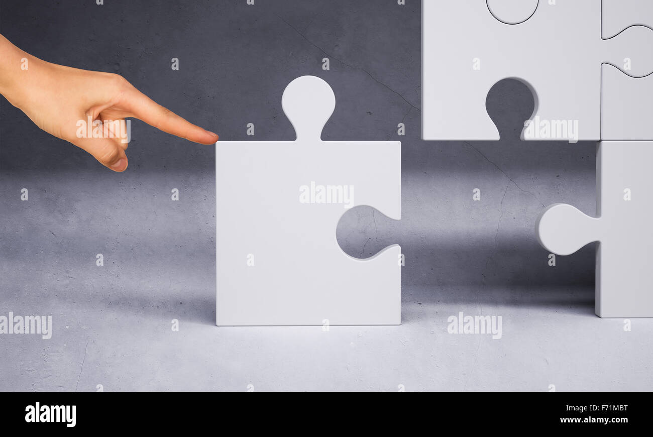 Man pushing puzzle piece -Fotos und -Bildmaterial in hoher Auflösung ...