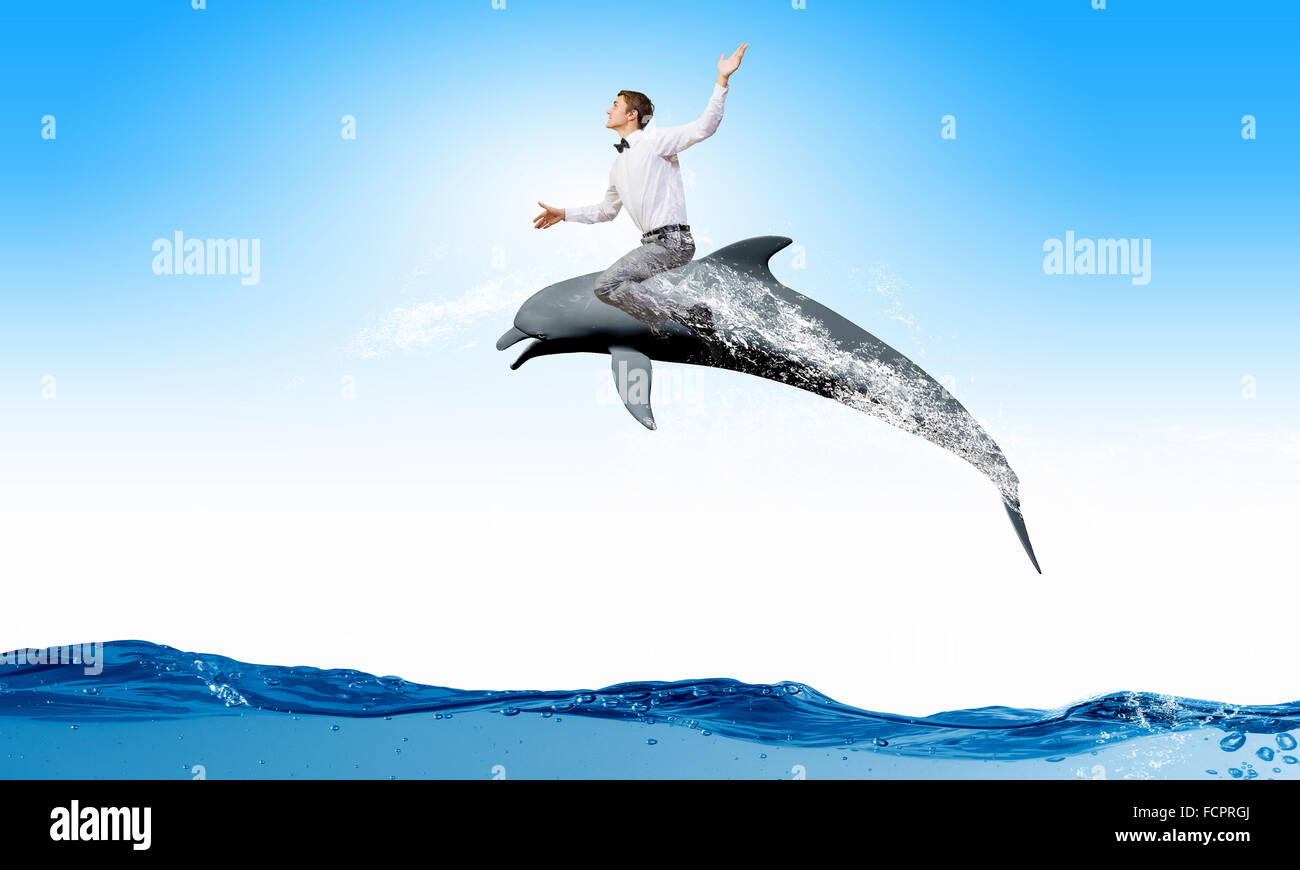 Man riding dolphin -Fotos und -Bildmaterial in hoher Auflösung – Alamy