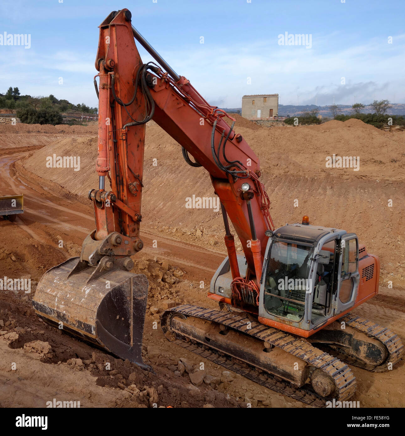 Bagger orange Maschinen auf der Baustelle Stockfotografie - Alamy