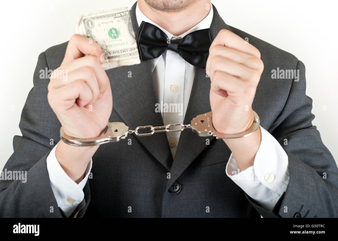 Handschellen geld -Fotos und -Bildmaterial in hoher Auflösung – Alamy