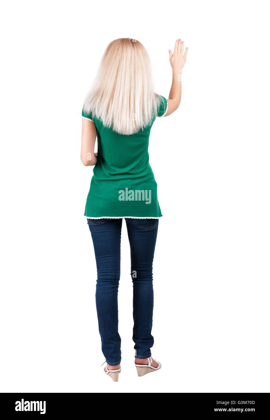 hinten Sie Ansicht der Frau von. Junge Frau in Jeans drückt auf etwas ...