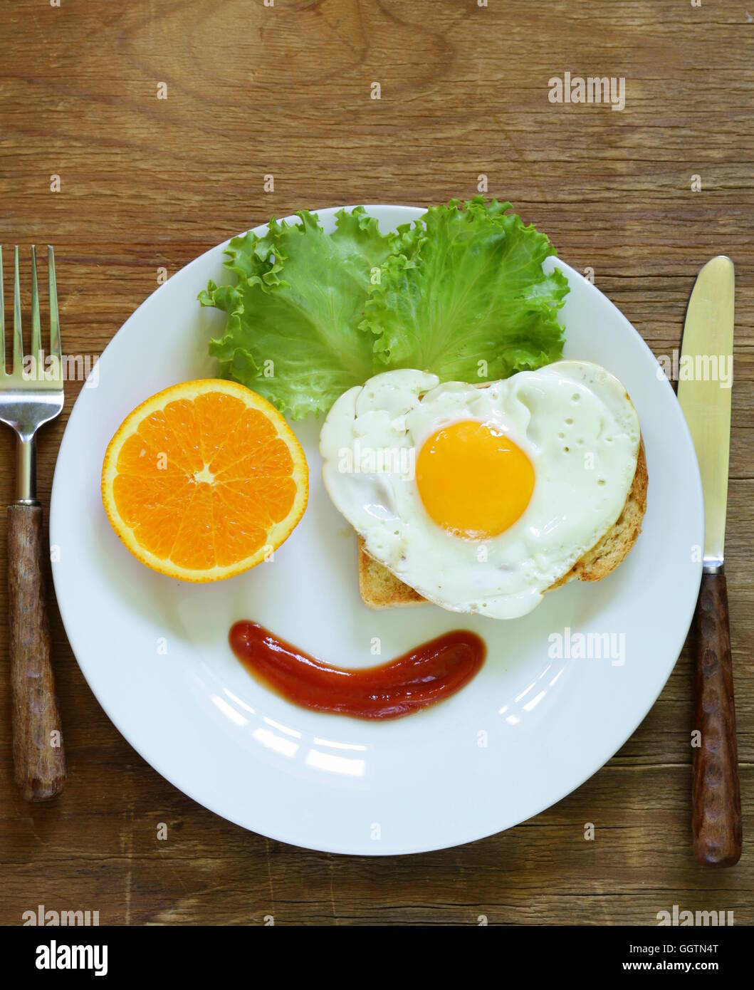 lustiges Gesicht, das Frühstück, Spiegelei und toast Stockfotografie ...