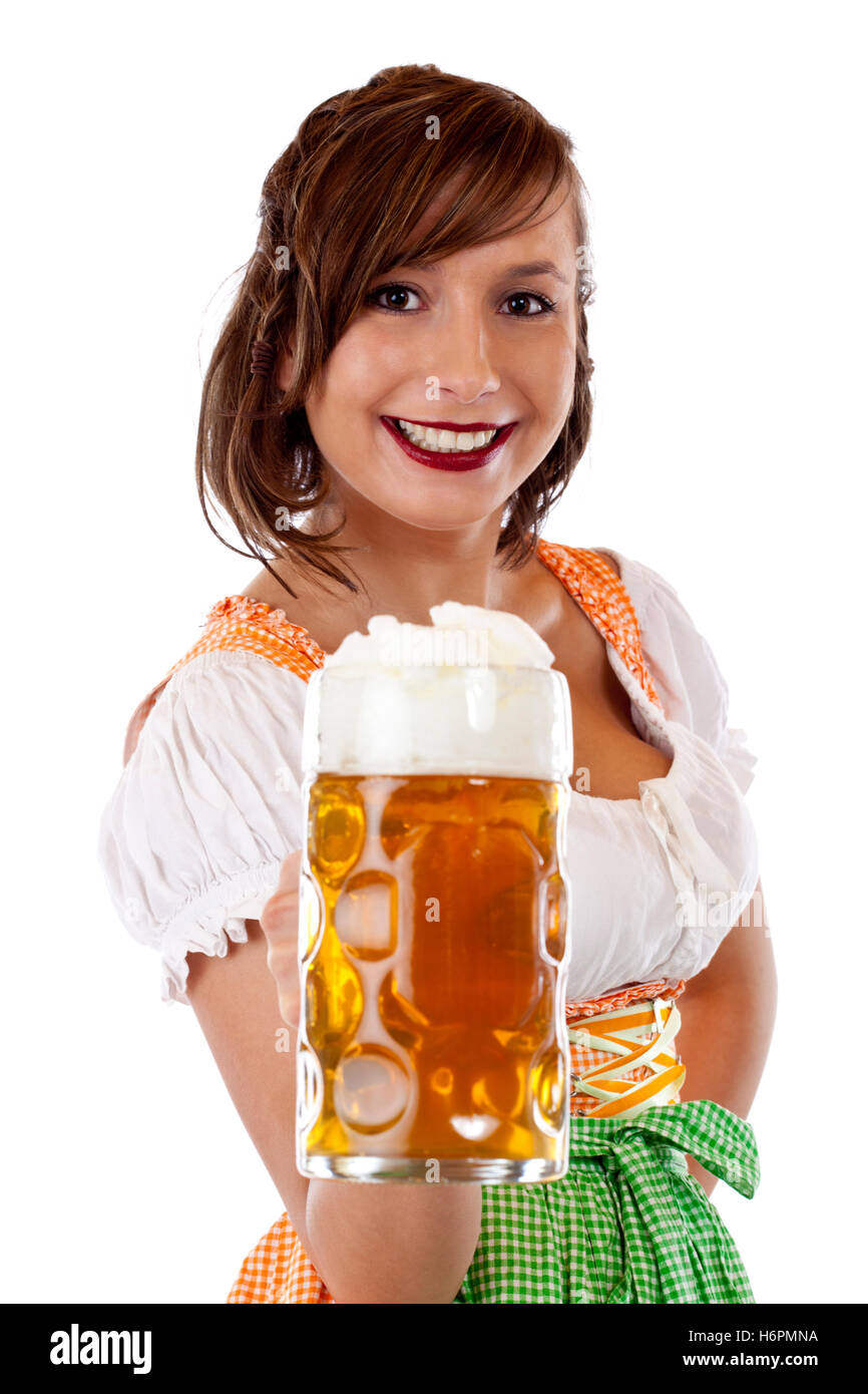 hübsche Frau im Dirndl lacht und hält Masskrug Oktoberfest Bier ...