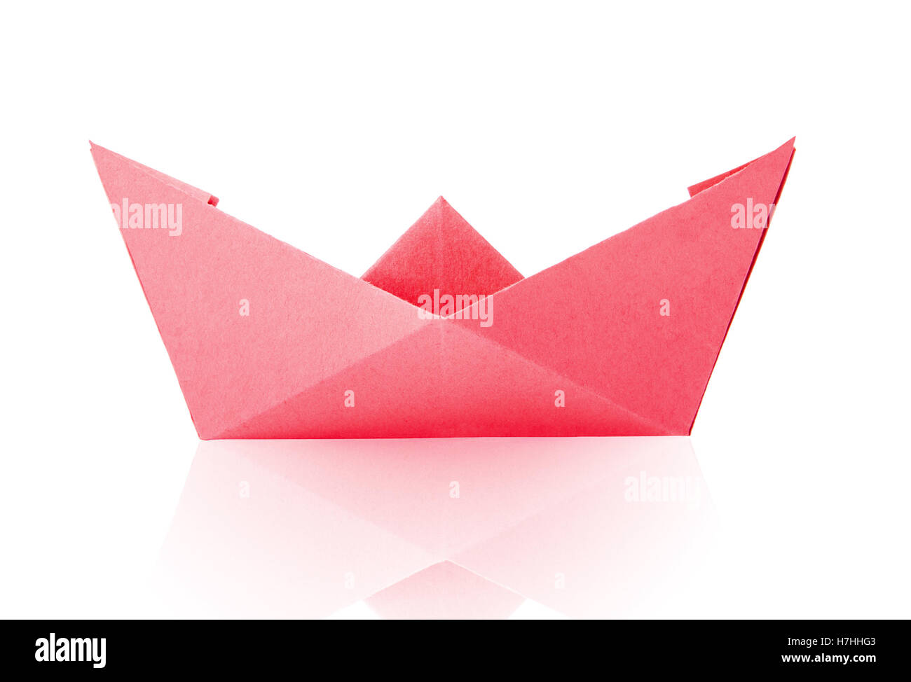 Origami in ein Papierschiff gefaltet Stockfotografie - Alamy