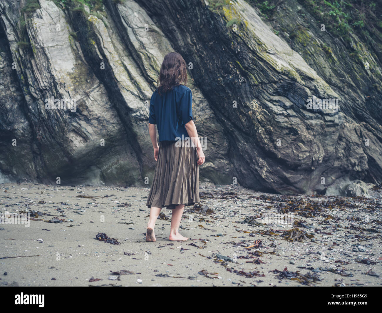 Young barefoot woman wearing skirt -Fotos und -Bildmaterial in hoher ...