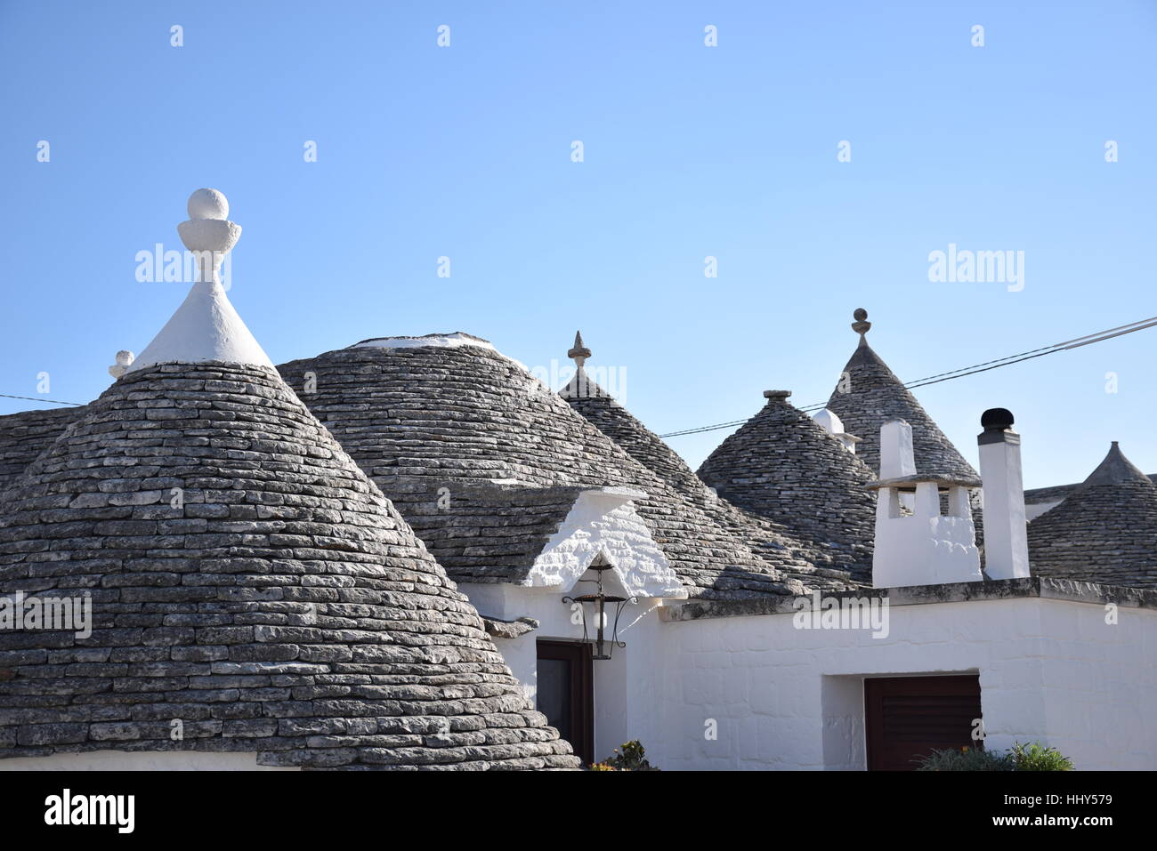 Die typische Kegeldach Trulli Häuser und ihre Symbole in Alberobello ...