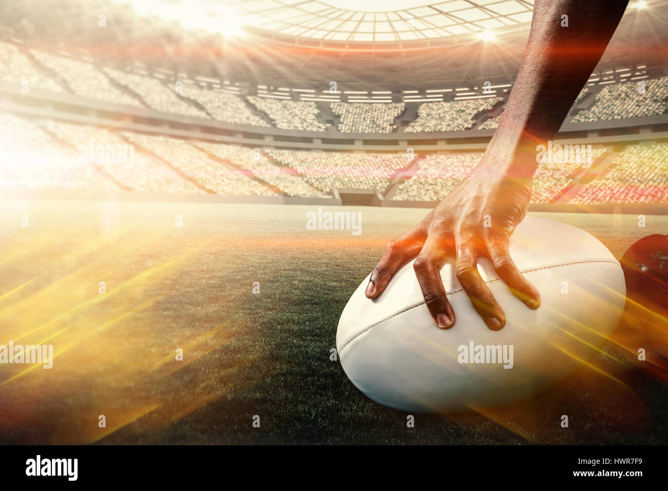 Zusammengesetztes Bild der freigestellten Bild des Athleten mit Rugby ...