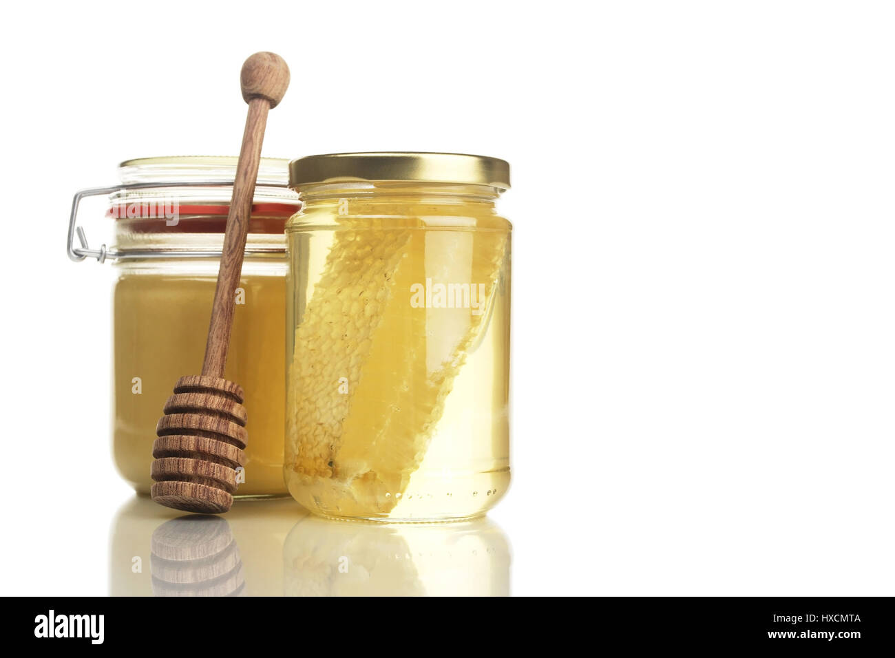 Gläser mit Honig und Honig-Löffel, Gläser mit Honig und Honig-Löffel ...