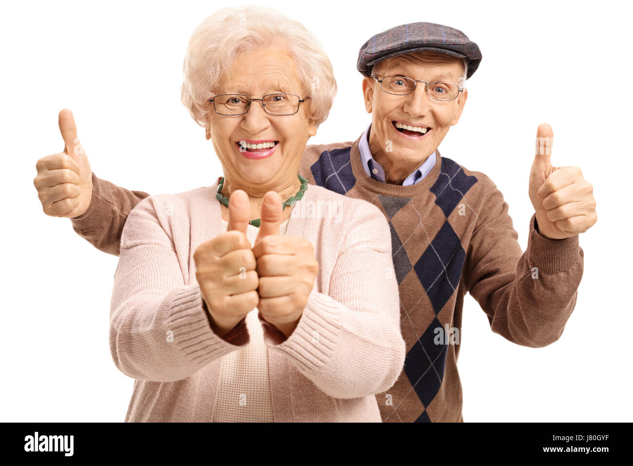 Überglücklich Senioren halten ihre Daumen hoch isoliert auf weißem ...