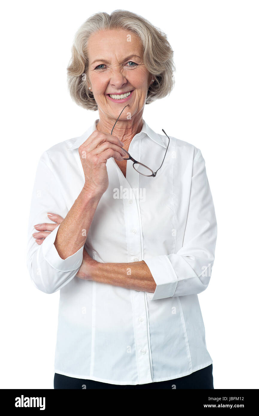 Alte Frau in formalen holding Lesebrille Stockfotografie - Alamy