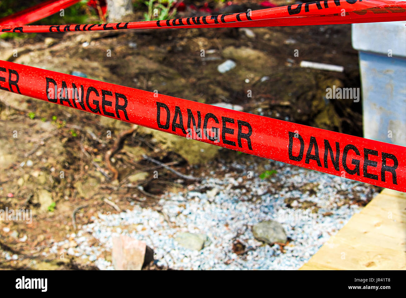 Gefahr-Band aus einem Betonfundament Absperrung Stockfotografie - Alamy