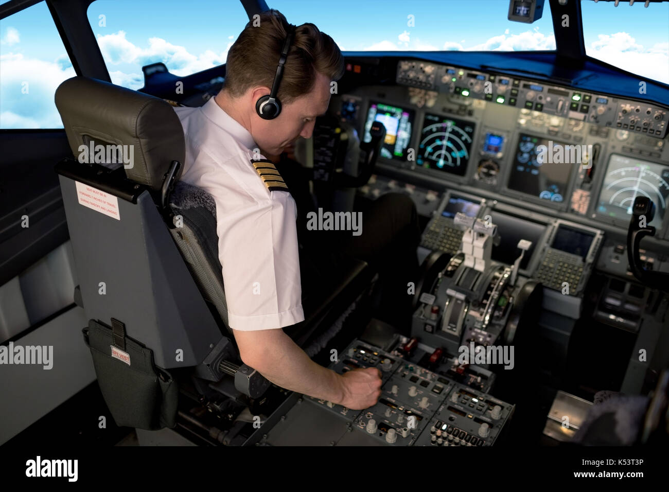 Young pilot sitting in cockpit -Fotos und -Bildmaterial in hoher ...