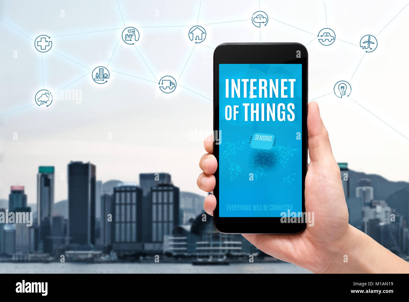 Hand Handy mit Internet der Dinge (Iot) Wort auf dem Bildschirm mit dem ...