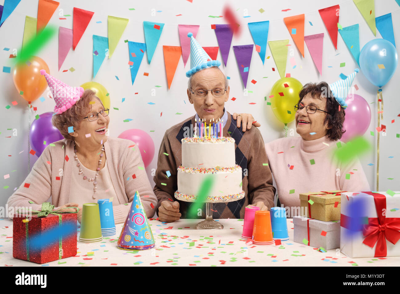 Three mature women at birthday party -Fotos und -Bildmaterial in hoher ...