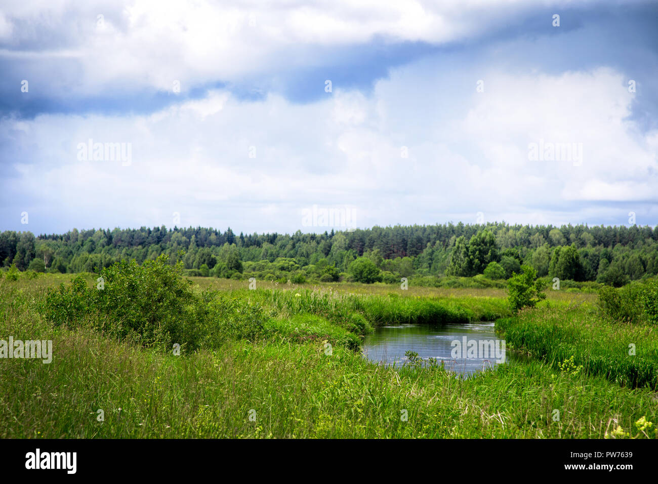 River Flows Through Meadow Stockfotos & River Flows Through Meadow ...