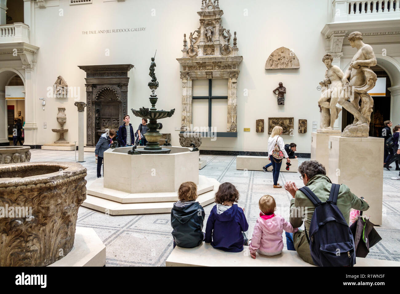 Man sitting on a stone men come up to him -Fotos und -Bildmaterial in ...