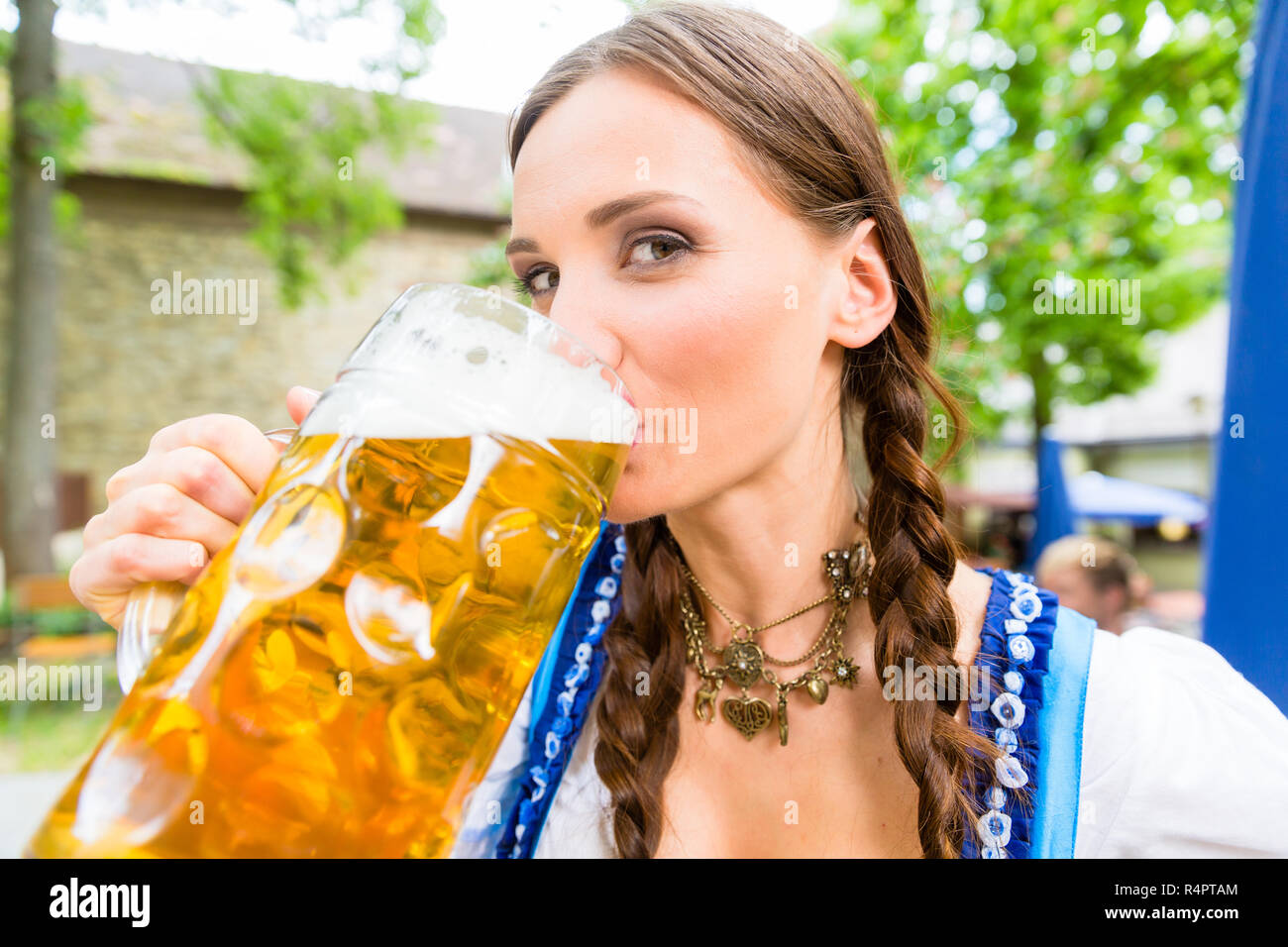 Woman beer dirndl plaits braids -Fotos und -Bildmaterial in hoher ...