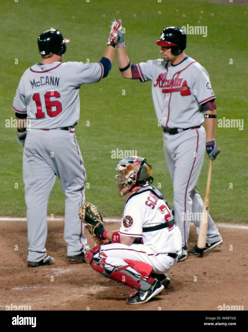 Atlanta Braves catcher Brian McCann (16) High-fives ...