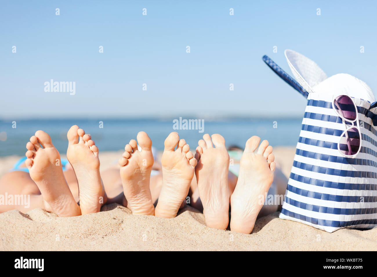 Three women girls lying sunbathing -Fotos und -Bildmaterial in hoher ...