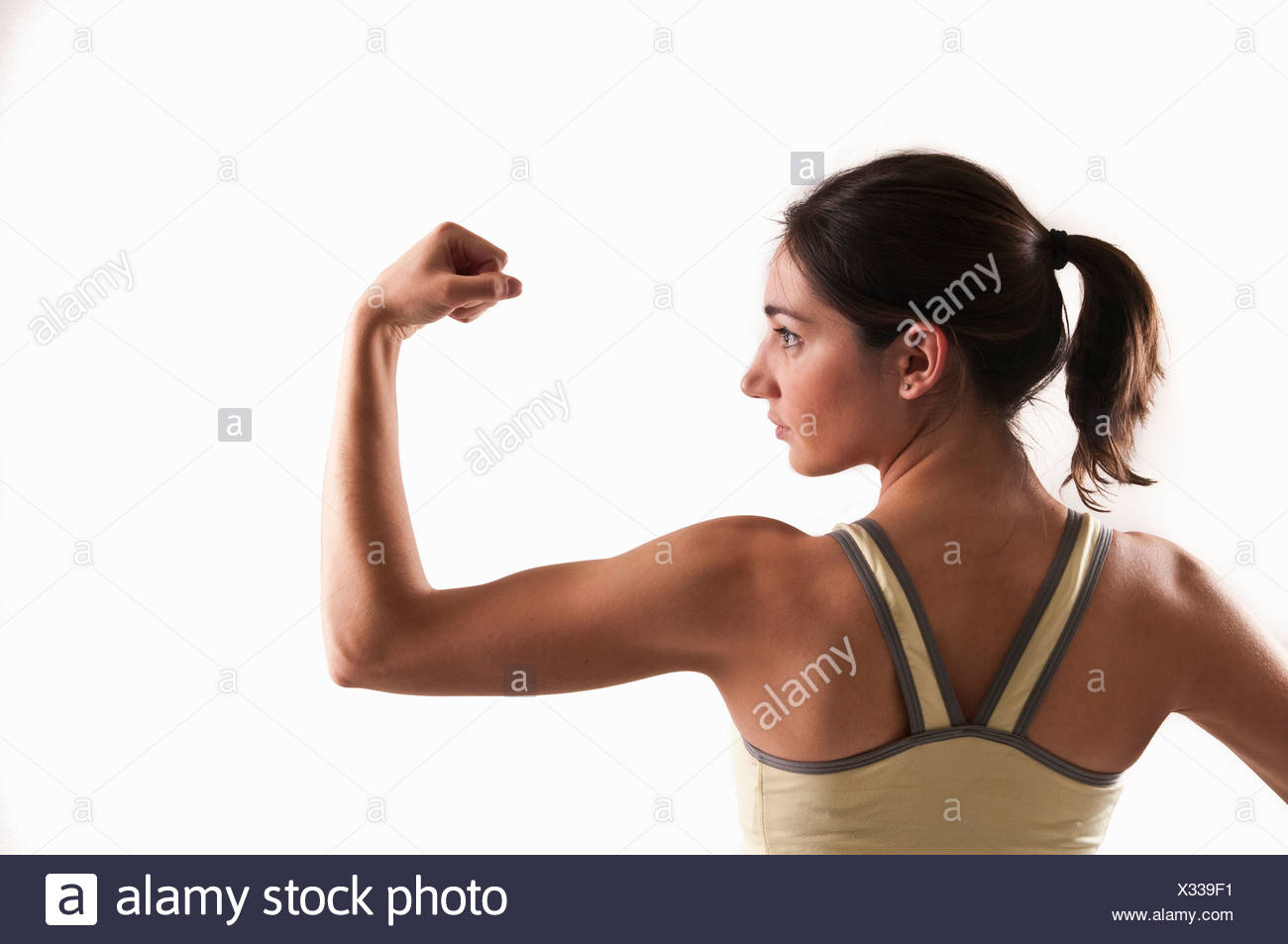 Flexing Muscle Woman Stockfotos und -bilder Kaufen - Alamy