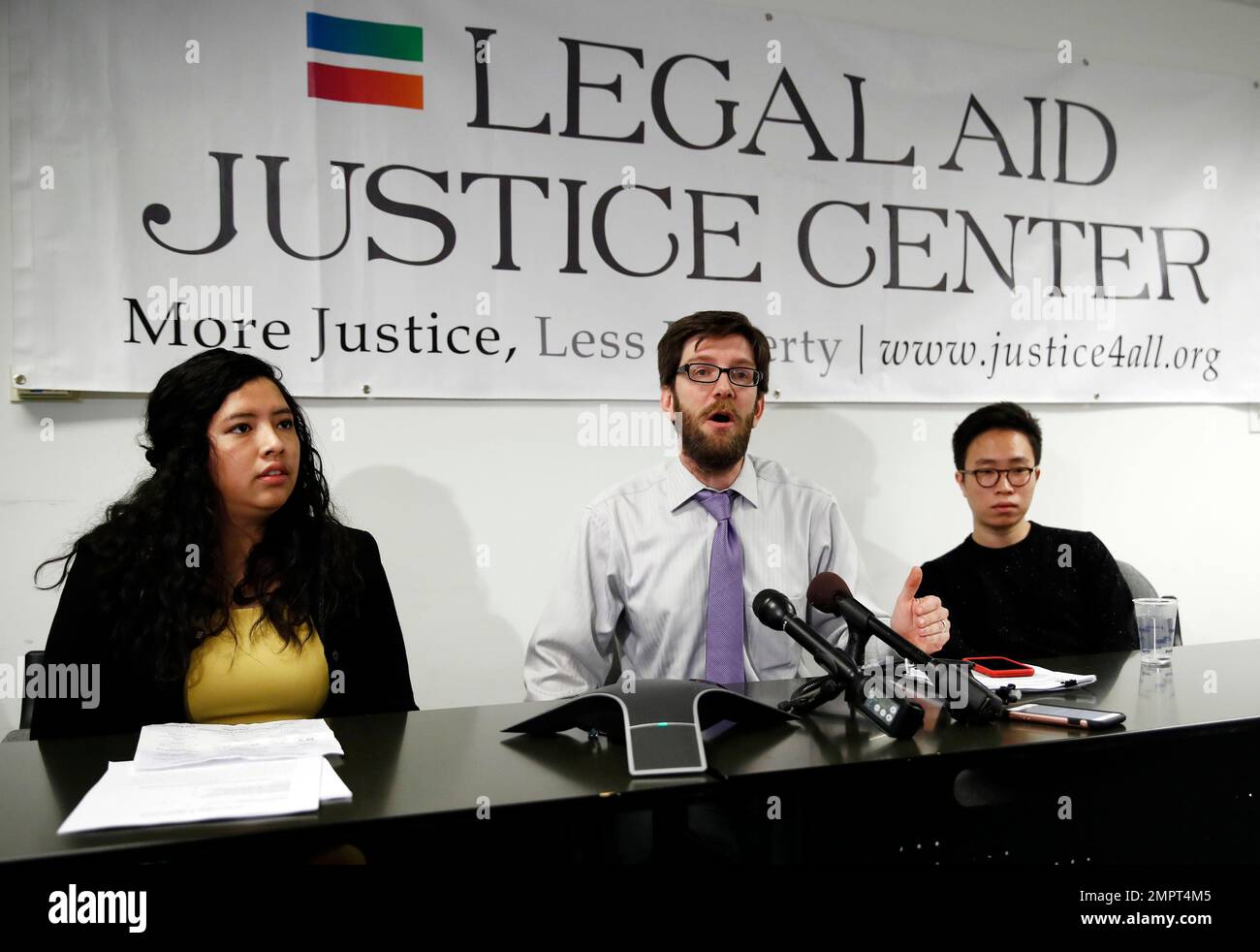 Legal Air Justice Center director Simon Sandoval-Moshenberg, center ...