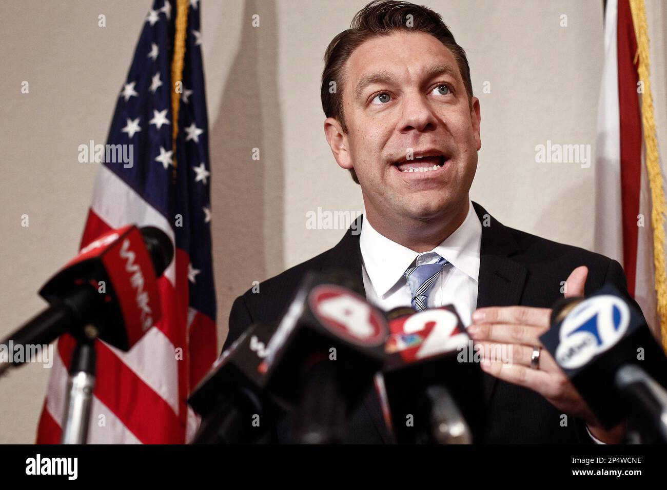 Congressman Trey Radel addresses the media alongside his wife Amy at ...