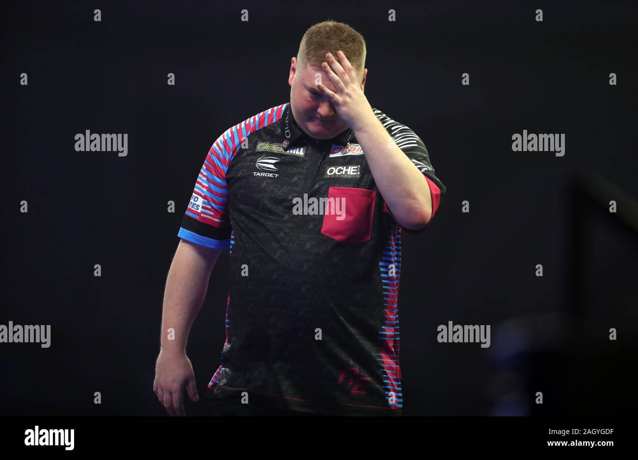 Ricky Evans réagit lors de son match contre Michael van Gerwen pendant ...
