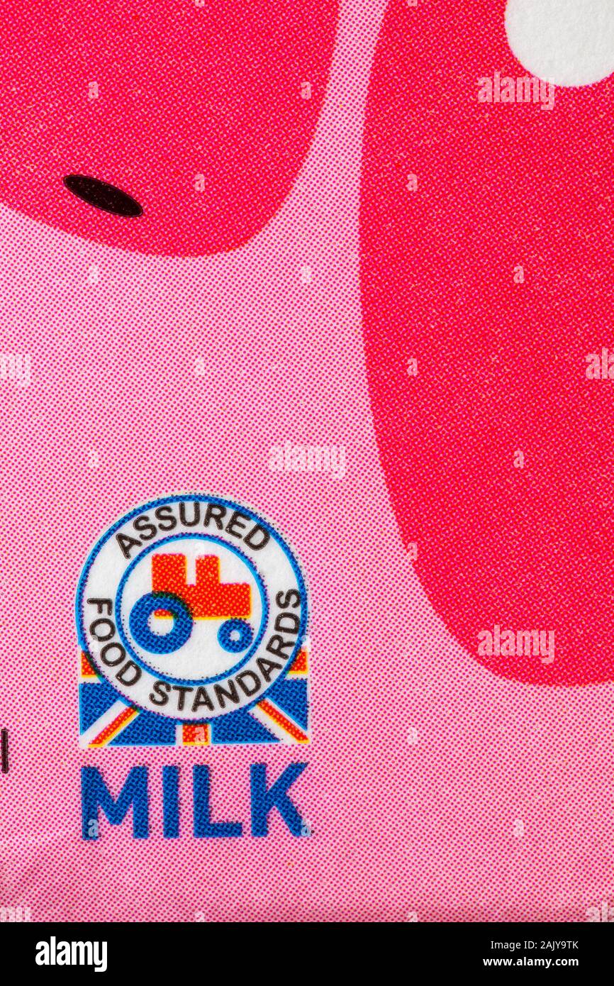 Petit tracteur rouge symbole du logo Assured Food Standards sur carton ...