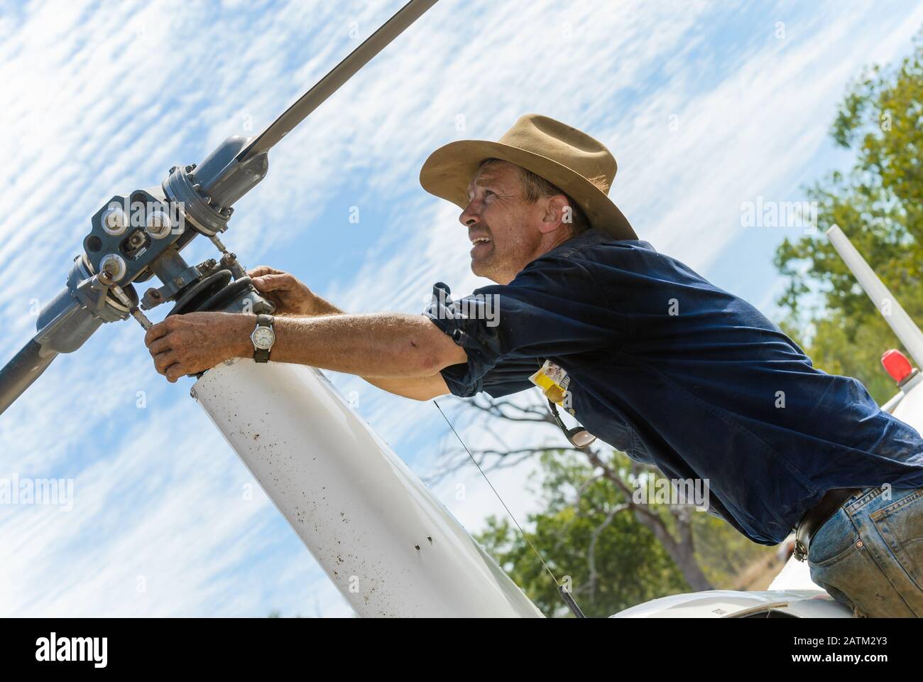 Cowboy with helicopter Banque de photographies et d’images à haute ...