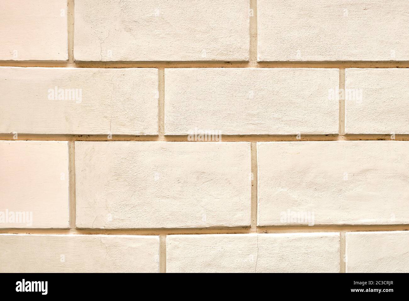 Arrière-plan d'un mur avec des dalles de pierre beige Photo Stock - Alamy