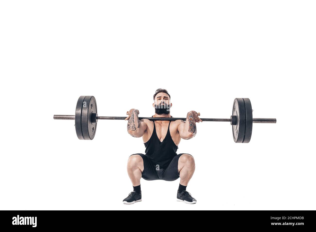 La technique de faire un exercice de la levée d'mort avec une barbell d ...