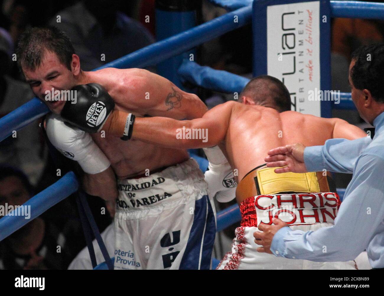 Chris John of Indonesia (R) hits Fernando Saucedo of Argentina during their World Boxing ...