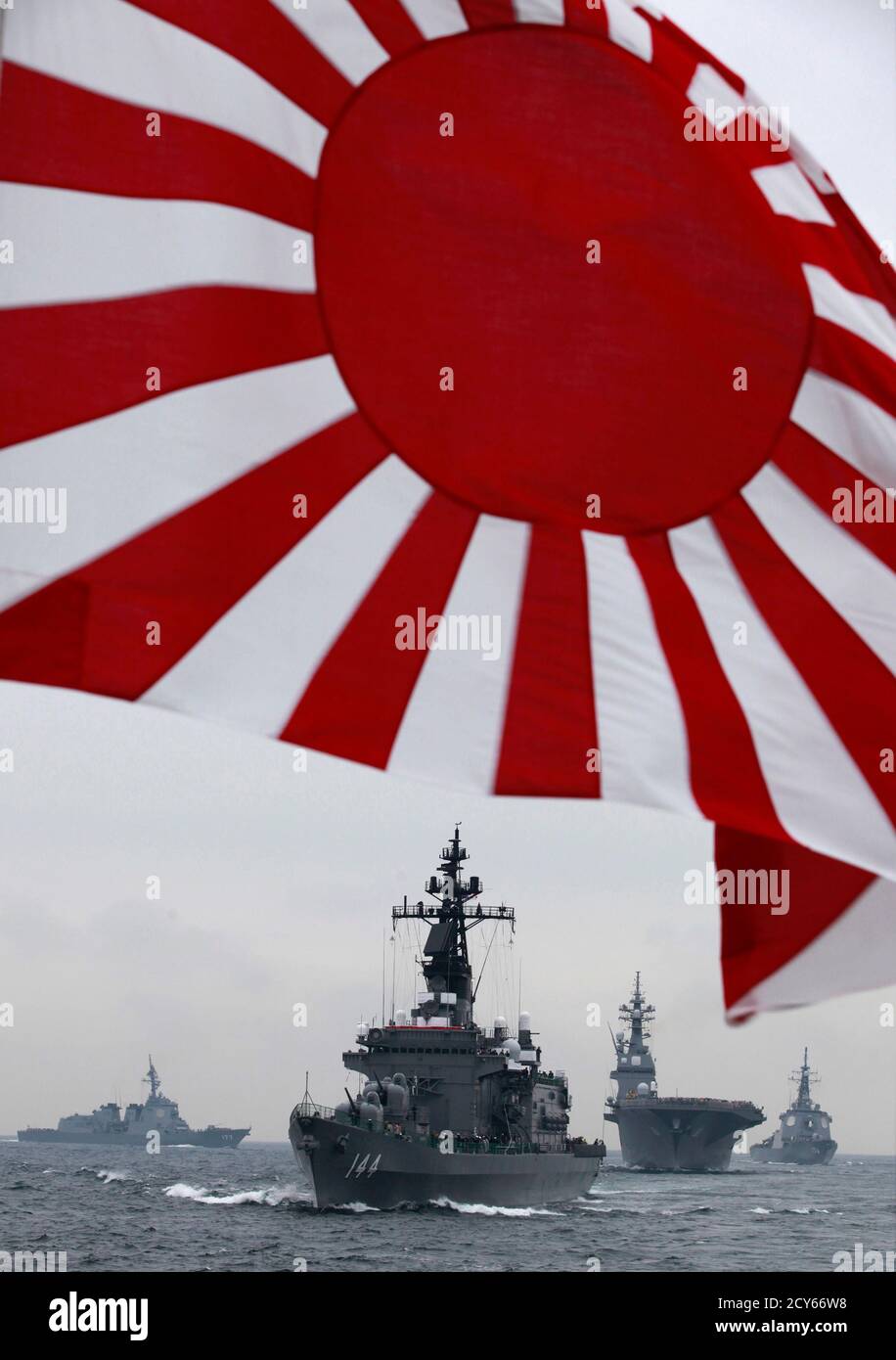 Japanese Maritime Self-Defense Force (MSDF) destroyer Kurama leads the ...