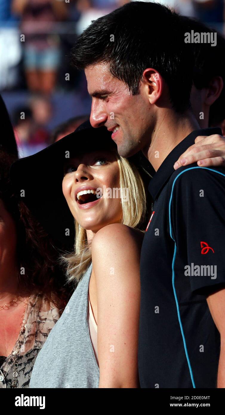 Australian actress Margot Robbie (L) looks at Serbian tennis player ...