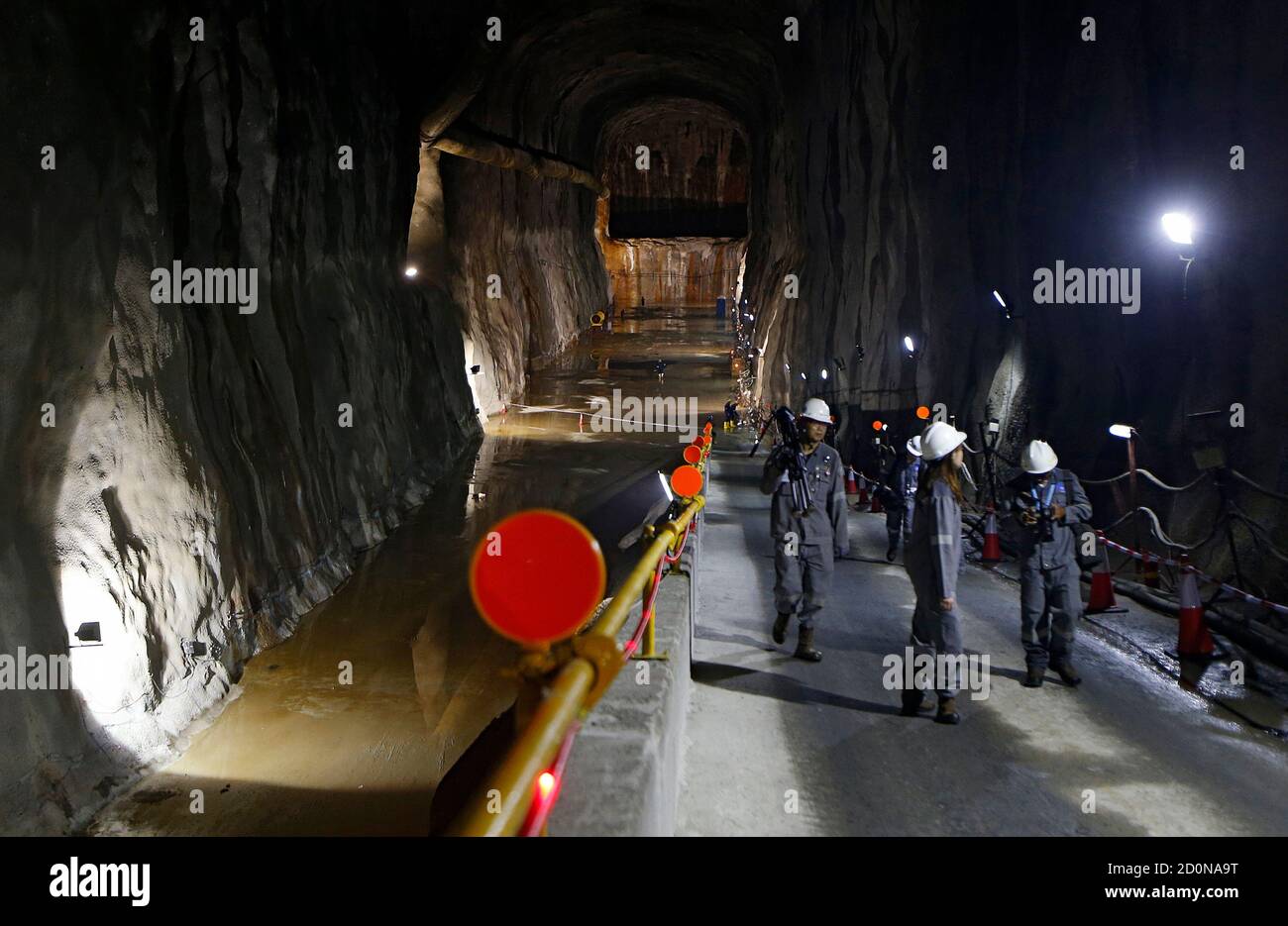 Visitors tour one of two completed caverns at the Jurong Rock Caverns ...