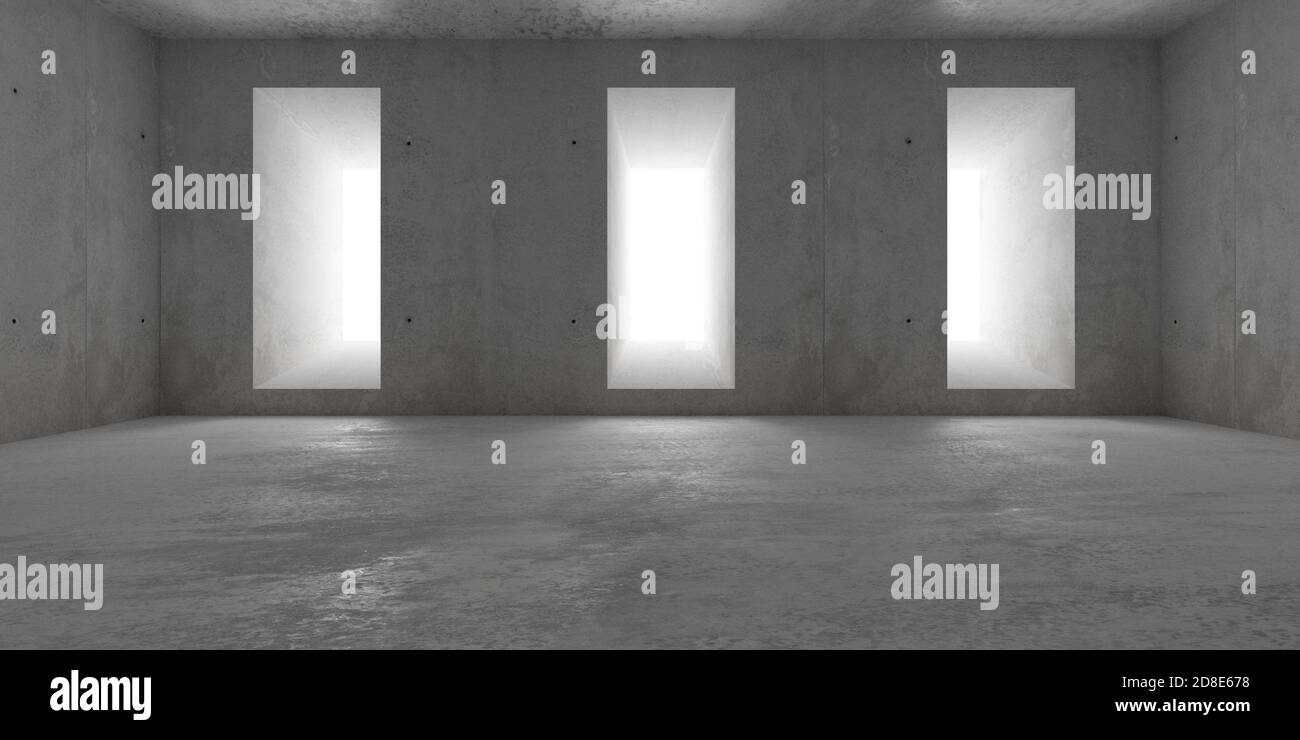 Salle en béton moderne et vide avec de larges ouvertures verticales sur ...