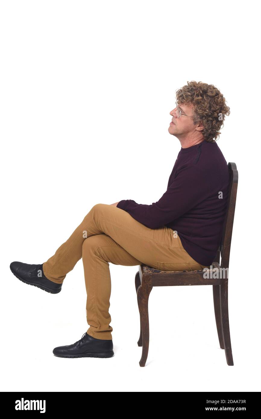 Homme assis Banque de photographies et d’images à haute résolution - Alamy