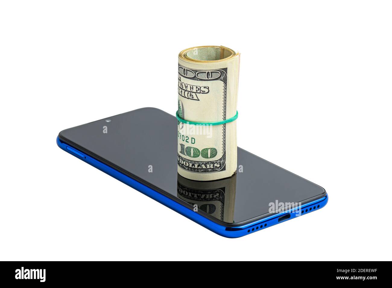 Rouleau de billets de dollars attaché avec un élastique et un téléphone ...