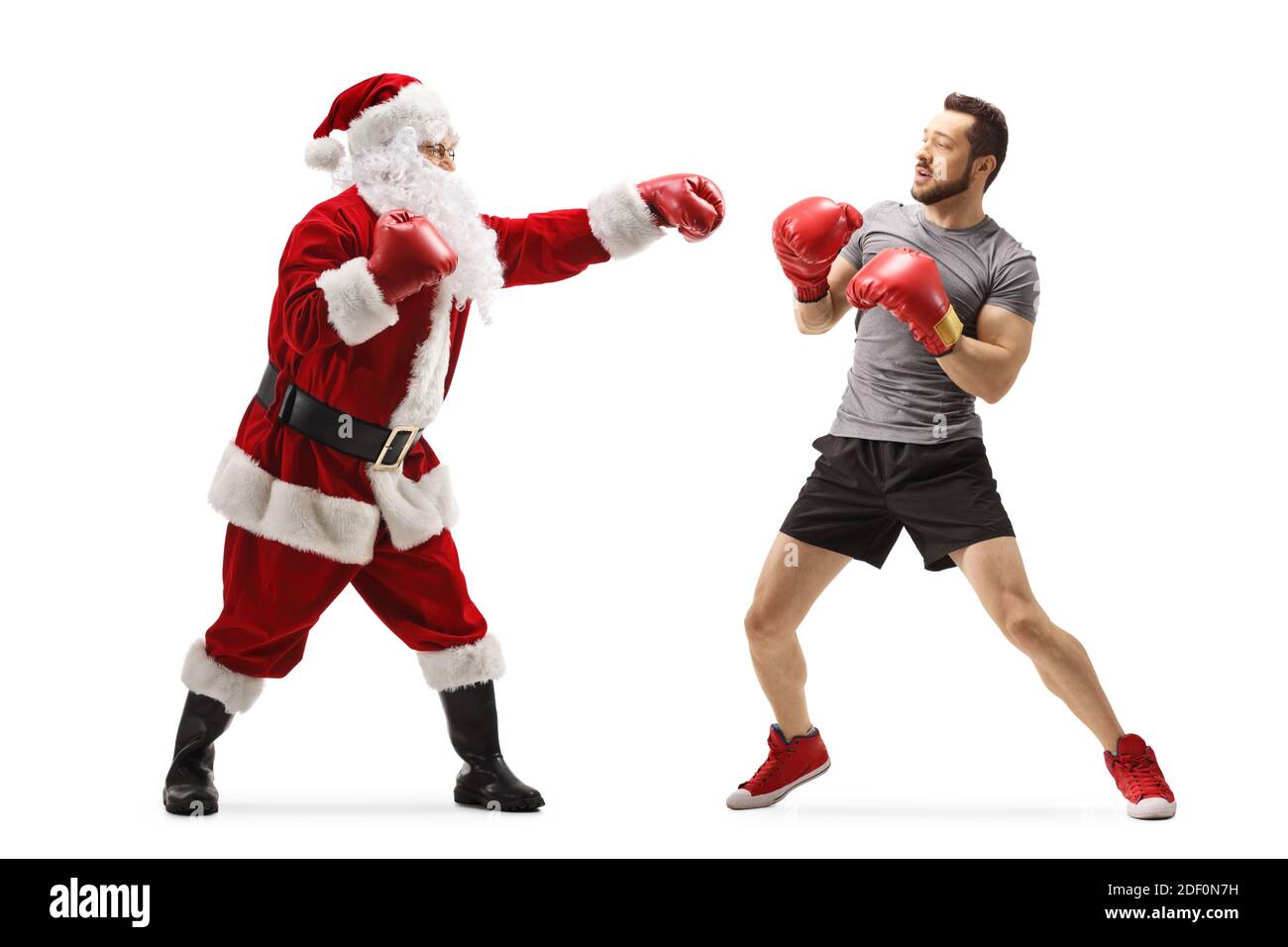 Prise de vue en profil d'un boxeur et du père noël combat avec des ...