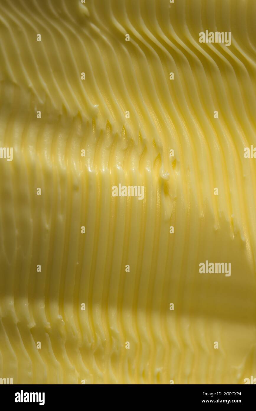 Image de texture des aliments verticale. Margarine pleine trame ...