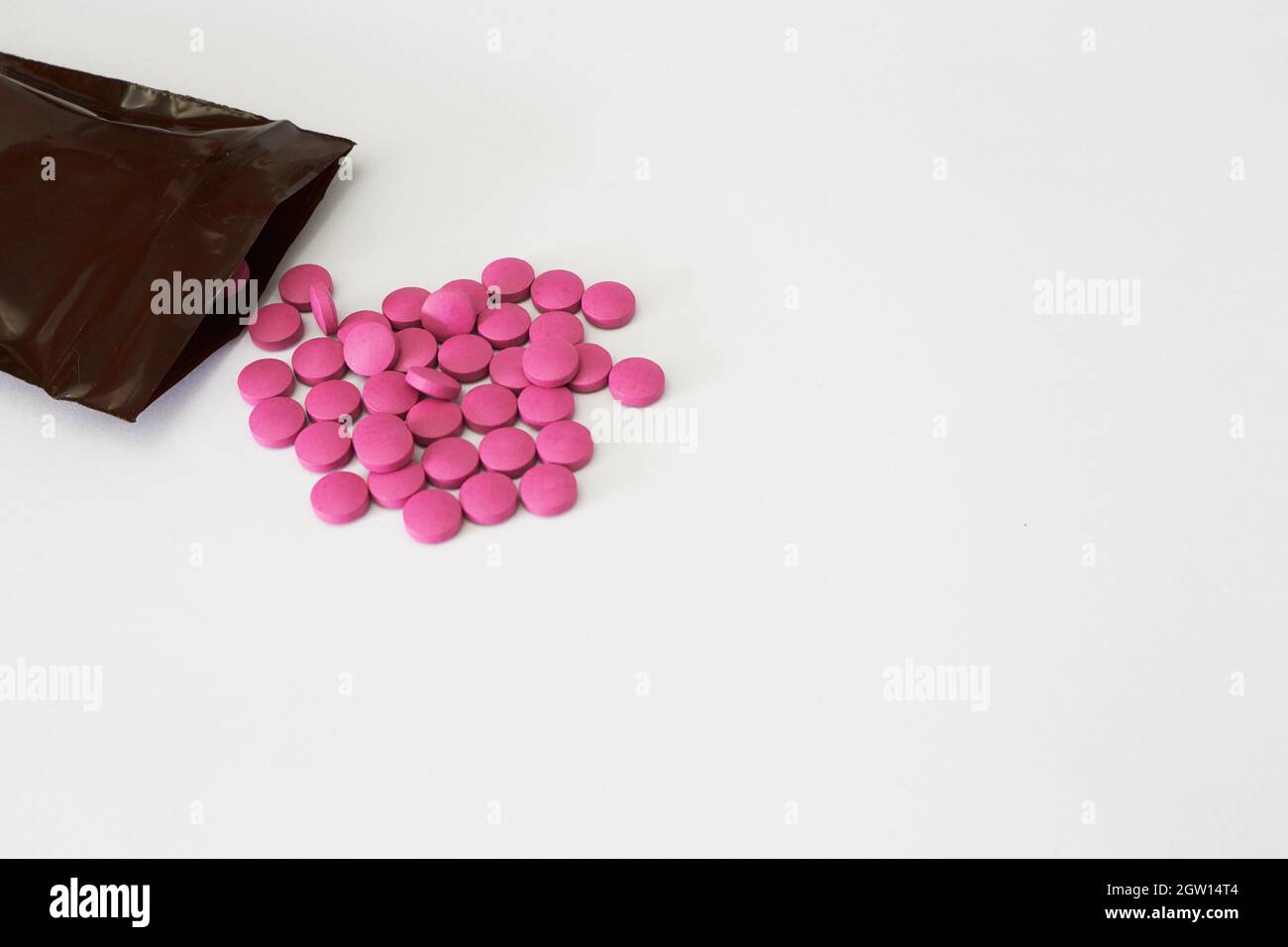 Pilule triangle rose et blanche Banque de photographies et d’images à ...