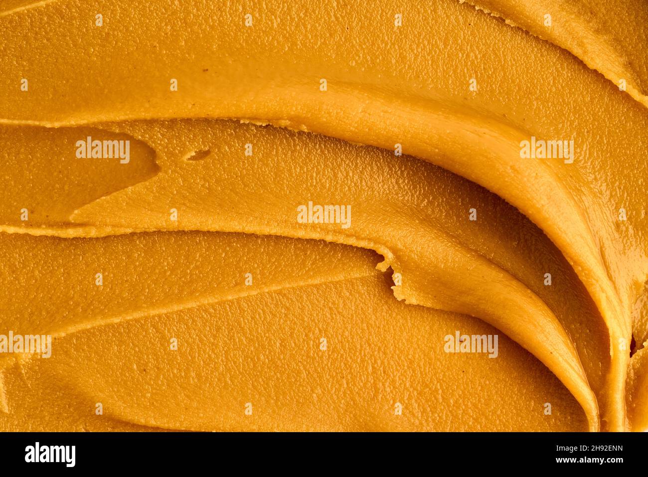Macro de beurre d'arachide américain enrober texture marron nutty lisse ...
