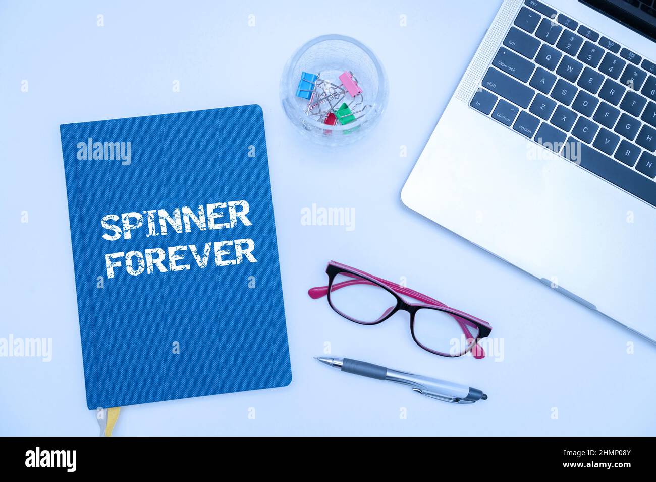 Affiche indiquant Spinner Forever. Mot pour soulager le stress pour ...